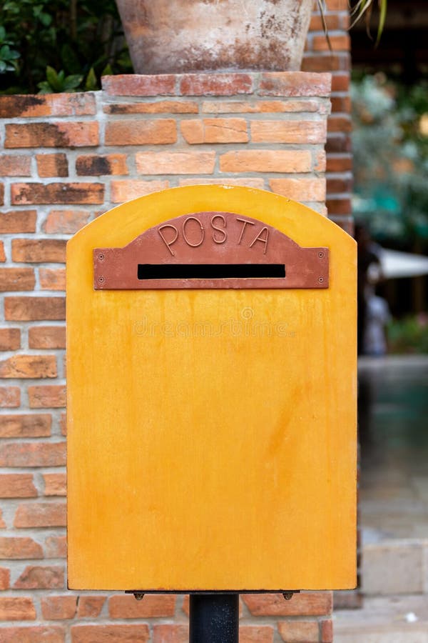 Yellow Mail Box on Brick Wall. Mailbox on the Street Stock Image ...