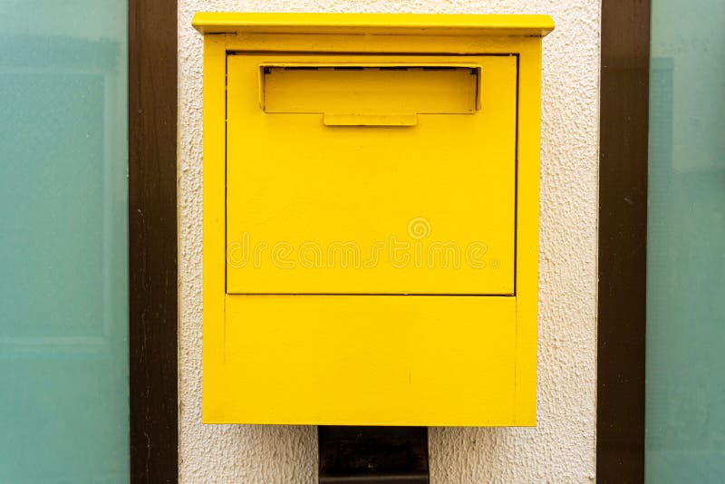 Yellow Mailbox Hanging on a Concrete Wall Outdoors Stock Image - Image ...