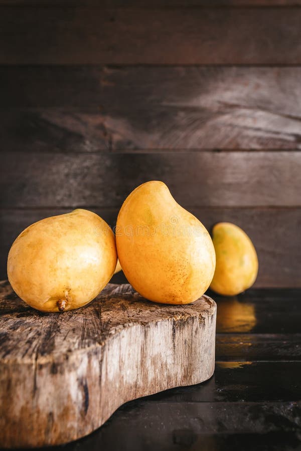 Yellow Mangoes stock image. Image of light, diet, natural - 73095161