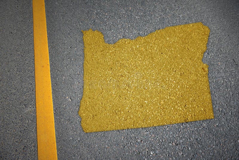 Yellow Map of Oregon State on Asphalt Road Near Yellow Line Stock Photo ...