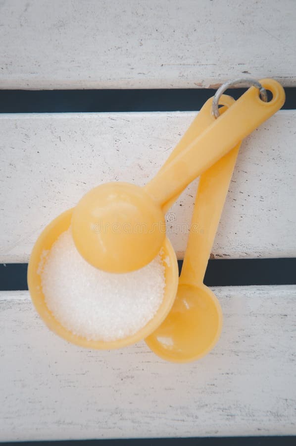 Yellow Measuring Spoons with Sugar Stock Photo - Image of cook, group ...