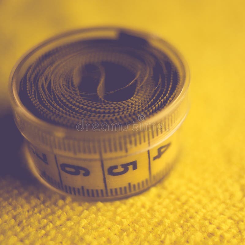 Yellow Measuring Tape in Box on the Table Stock Photo - Image of meter ...