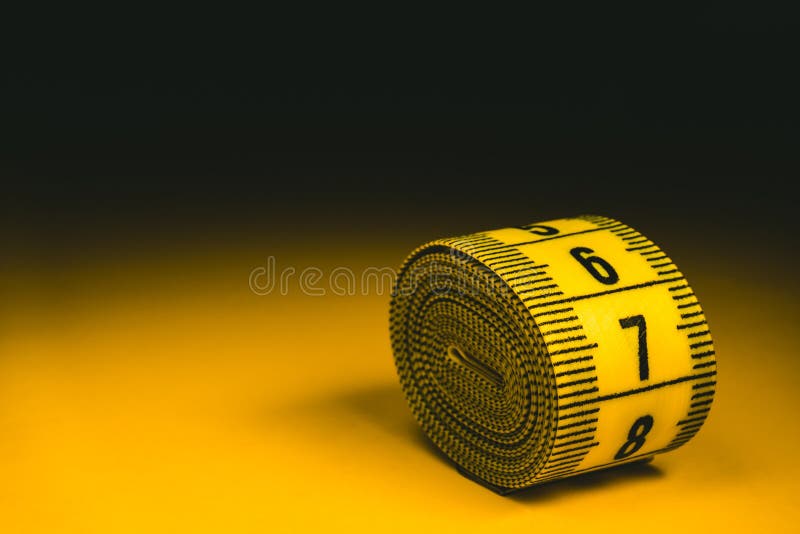 Yellow Measuring Tape on Color Background. a Measuring Tape on Yellow ...