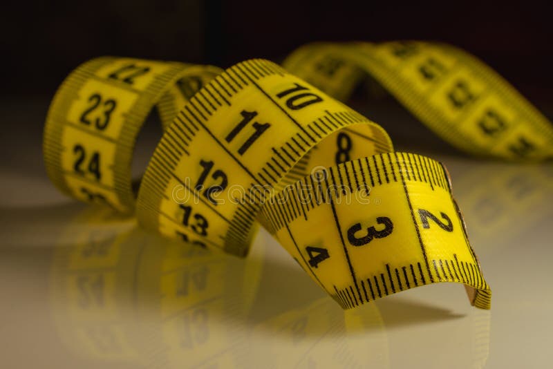 Yellow Measuring Tape on Color Background. a Measuring Tape on Yellow ...