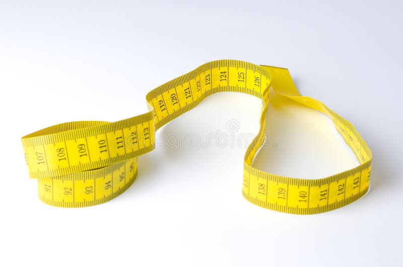 Yellow Measuring Tape Curled on White Background Stock Image - Image of ...