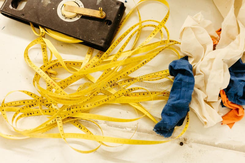 Yellow Measuring Tape Positioned Against a Background of Fabric Stock ...
