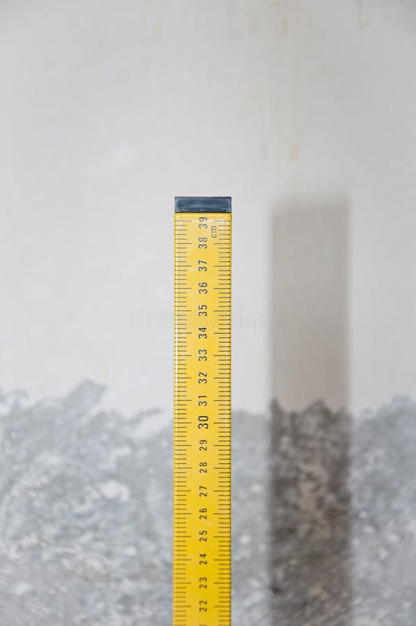 Yellow Metal Ruler Measuring Tape Cement Background Stock Image - Image ...