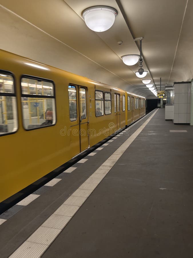 Yellow Metro Train Leaving a Station in Berlin Stock Photo - Image of ...