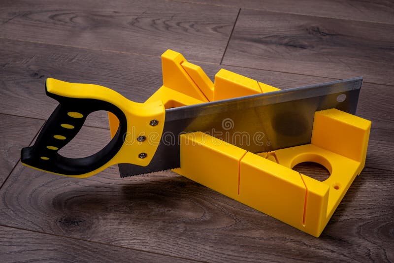 Yellow Miter Box and Hand Saw Stock Photo - Image of laminated, closeup ...