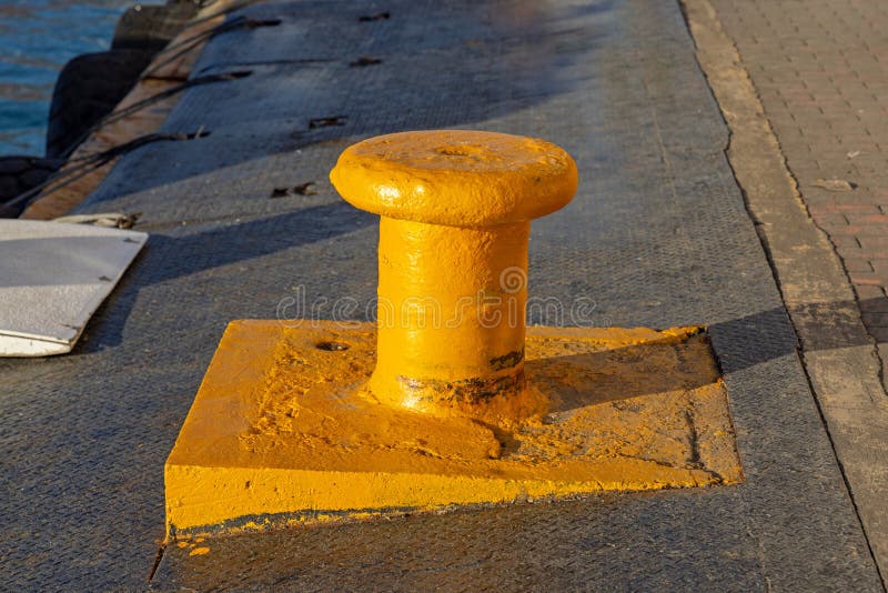 Yellow Mooring Bollard stock image. Image of safety - 377982485