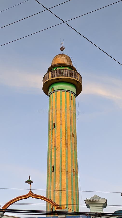 Yellow Mosque Minaret with Blue Sky Background Stock Image - Image of ...