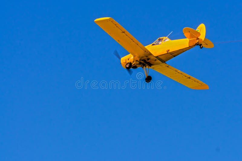 Yellow Motorized Aircraft in the Blue Sky Stock Image - Image of ...