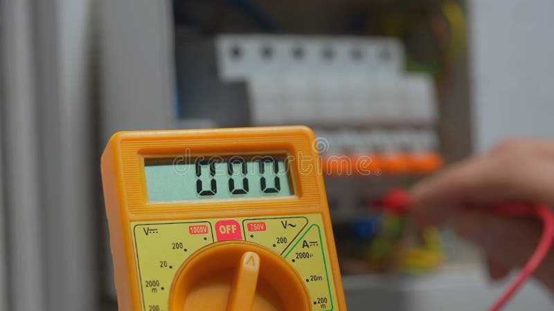 Yellow Multimeter for Measuring Voltage Close Up. Work Under Voltage ...