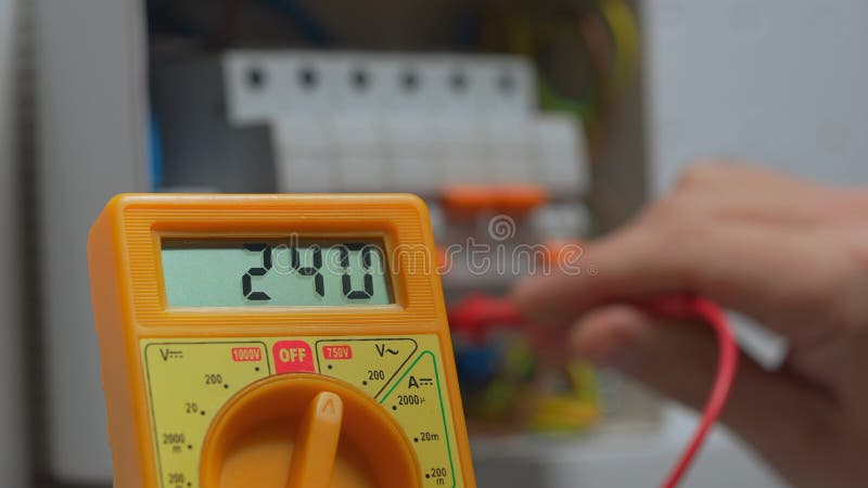 Yellow Multimeter for Measuring Voltage Close Up. Work Under Voltage ...