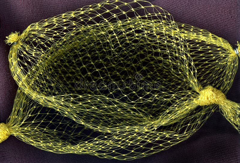 Yellow net sacks stock photo. Image of metal, clip, container - 5526820