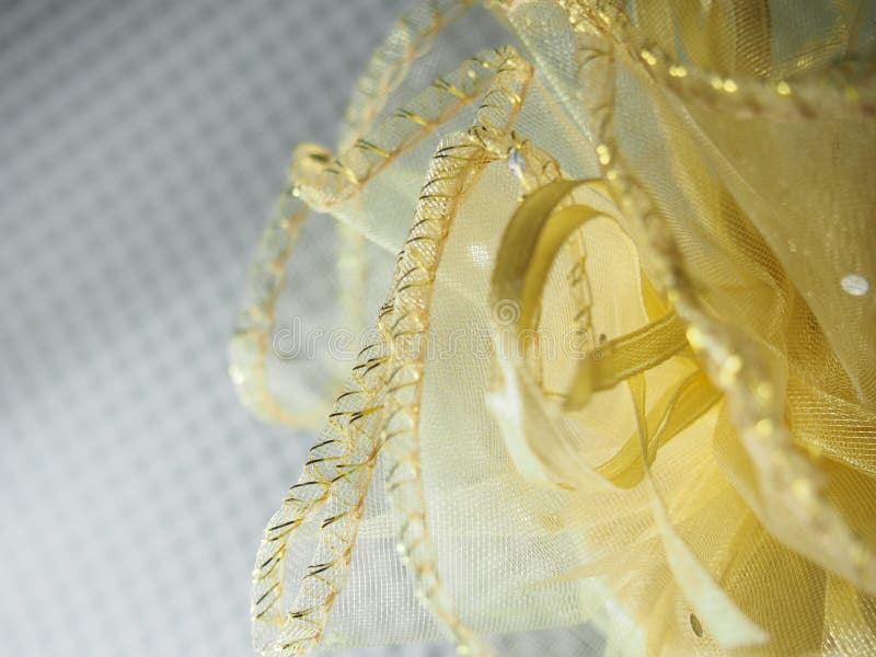 Yellow Netted Fabric, Wrapped with Ribbon Stock Photo - Image of fabric ...