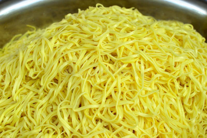 Yellow noodles in kitchen stock photo. Image of japan - 77947692
