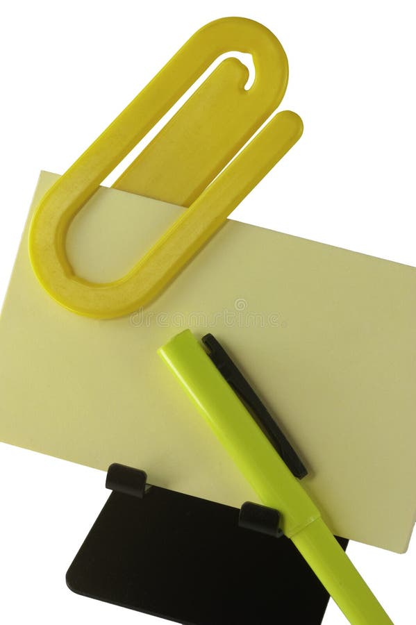 Closeup of Notepad, Paperclip and Pen on Stand in Yellow and Black ...