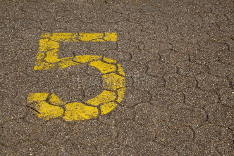 Yellow Number 5 Painted on Concrete Paving Stones Stock Photo - Image ...