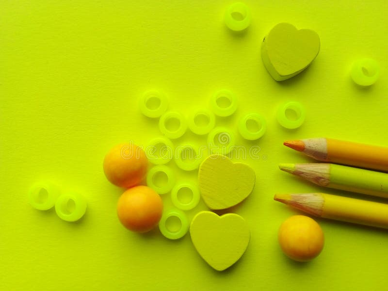 Yellow Objects on a Yellow Background Stock Image - Image of hearts ...