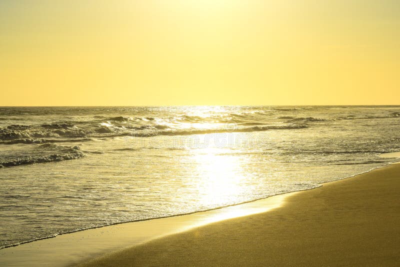 Yellow Ocean with Bright Sunlight Stream Intersecting Wave Swell ...