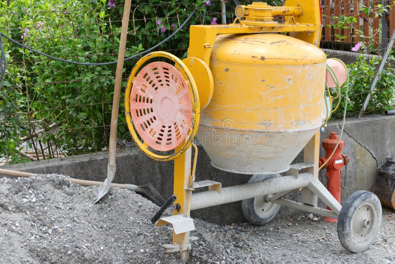 Yellow old Concrete Mixer stock image. Image of labor - 192167765