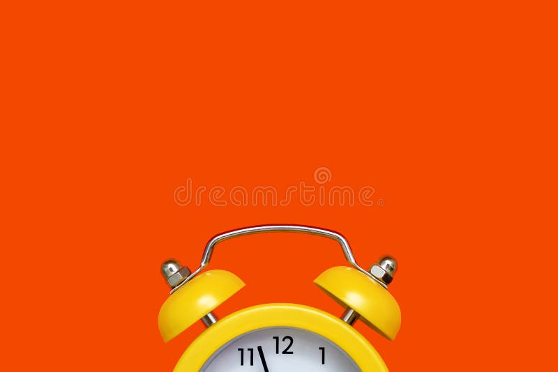 Yellow Old-fashioned Alarm Clock with a Dial on a Orange Background ...
