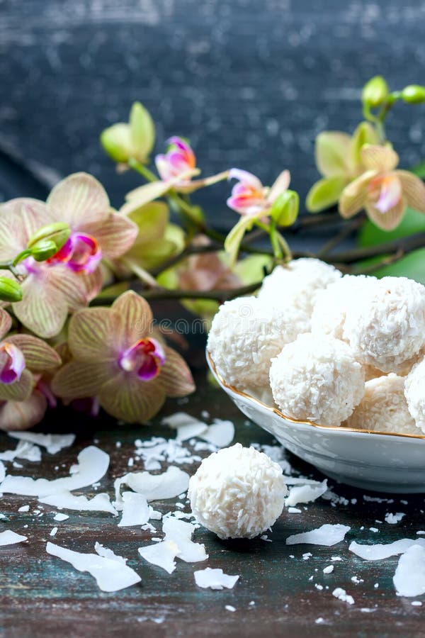 Yellow Orchid and ?omemade Coconut Sweets. Stock Image - Image of ...