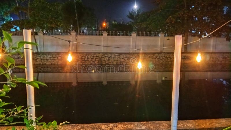 Yellow Outdoor Lights, Seen in the Cafe Area Stock Image - Image of ...