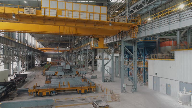 Yellow Overhead Crane in a Modern Factory. the Work of an Overhead ...