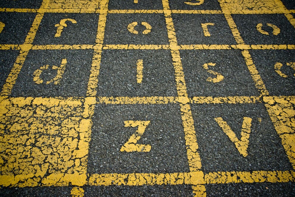 Yellow Painted Letters on Asphalt Stock Photo - Image of game, paint ...