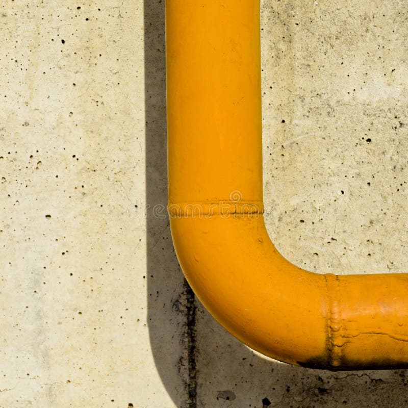 Yellow Metal Pipe on Unplastered Concrete Stock Photo - Image of ...