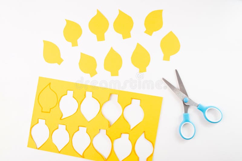 Yellow Paper Cutouts in the Shape of Flames, Crafting Activity, Step in ...