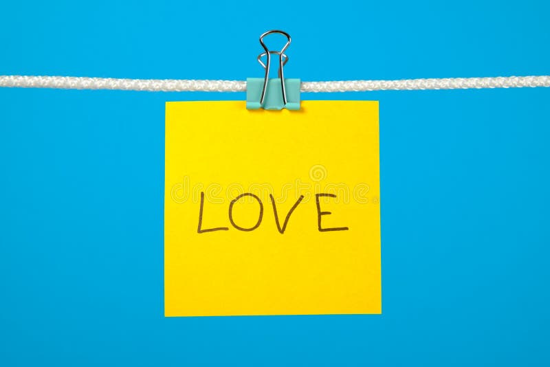 Yellow Paper Note on Clothesline with Text â€œLoveâ€ Stock Image ...