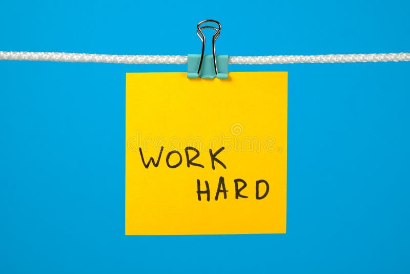 Yellow Paper Note on the String with Text “Work Hard” Stock Image ...