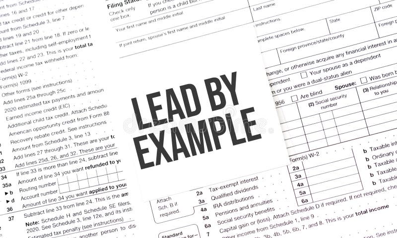 Words LEAD by EXAMPLE Written on Torn Paper on a Computer Keyboard ...