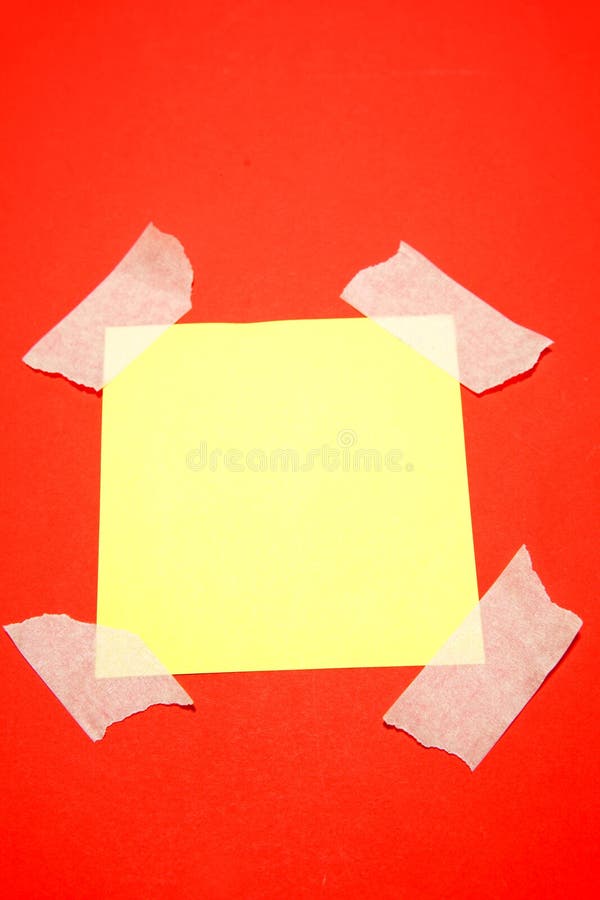 Yellow paper taped to red stock image. Image of memo, studio - 5680601