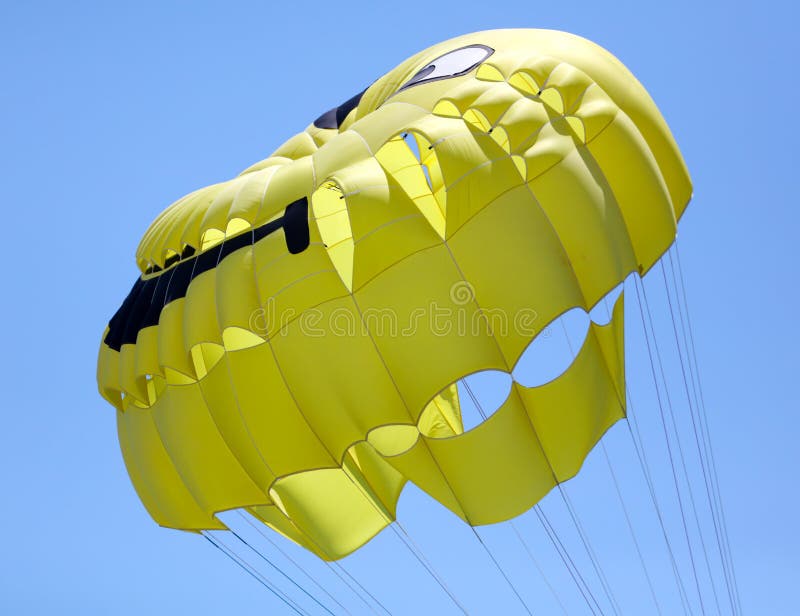 A Yellow Parachute Flies in the Sky Stock Photo - Image of wind ...