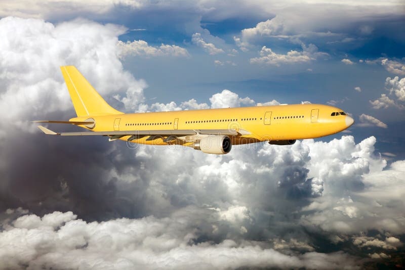 Yellow Passenger Plane Flying Over the Clouds. Side View. Stock Image ...