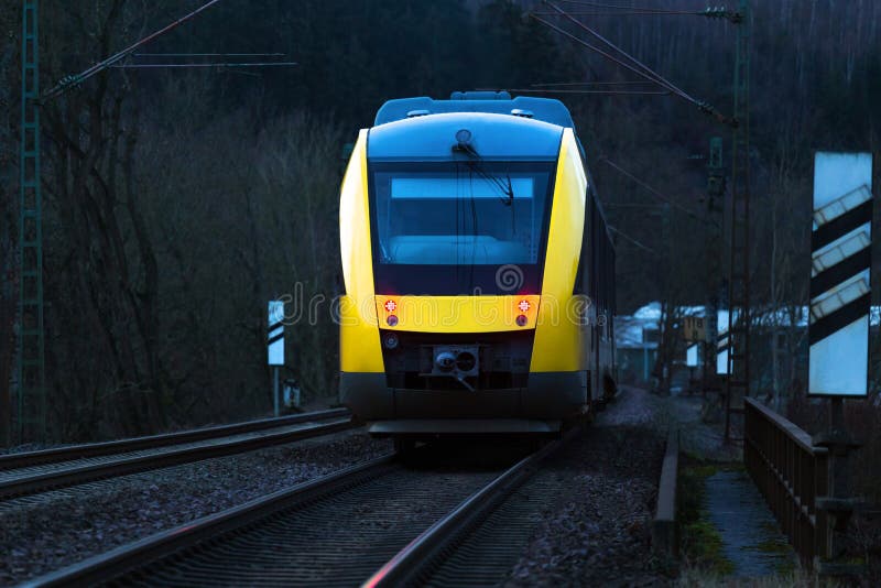 Yellow Passenger Train in the Evening Stock Photo - Image of passenger ...