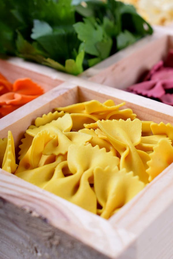 Yellow Pasta Farfalle in a Wooden Box Stock Photo - Image of macaroni ...