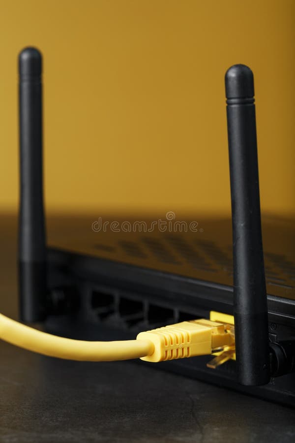 A Yellow Patch Cord is Inserted into the Wi-Fi Port of the Router To ...