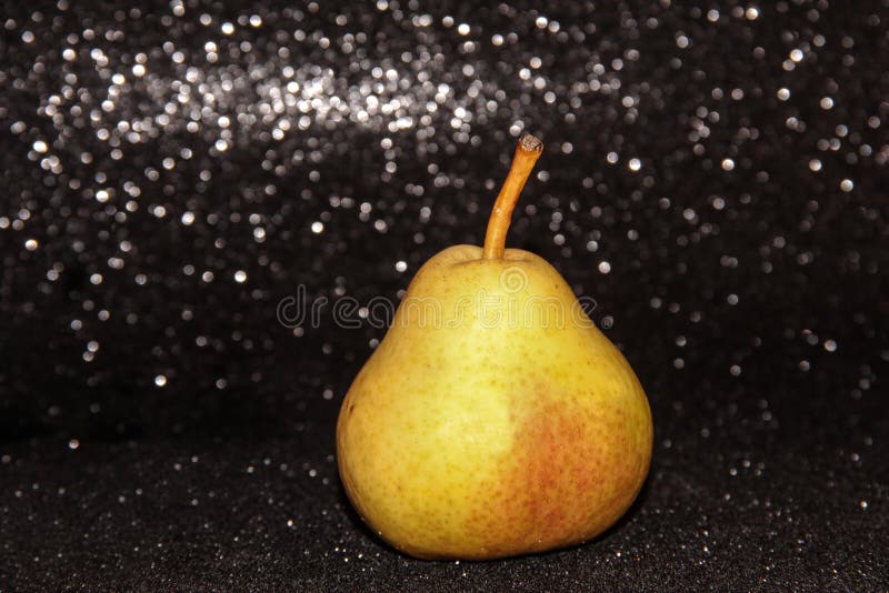 Yellow Pear on a Shiny Black Background Stock Photo - Image of yellow ...
