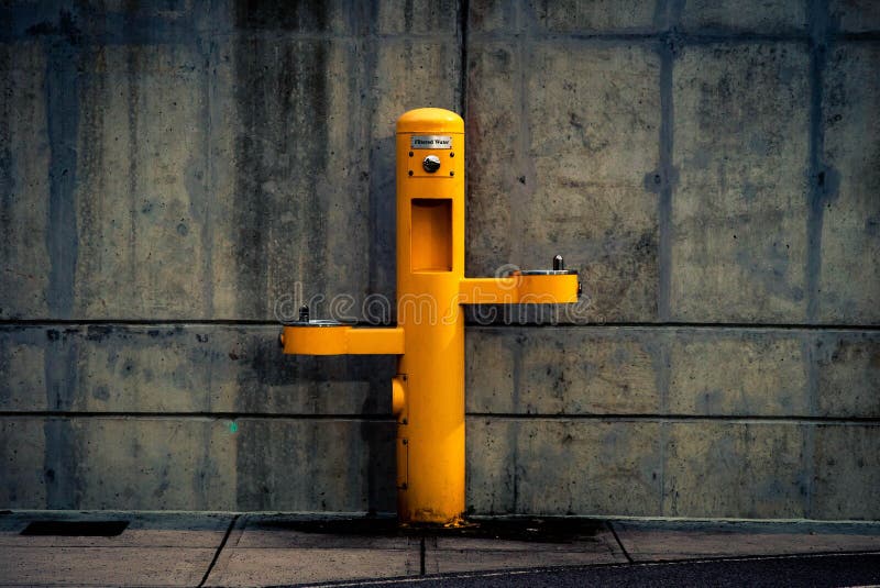 Yellow Pedestal Outdoor Post Against the Wall Stock Photo - Image of ...