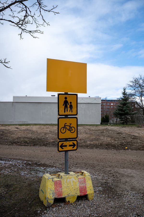 Yellow Pedestrian and Bicycle Path Direction Sign on a Dirt Trail at ...