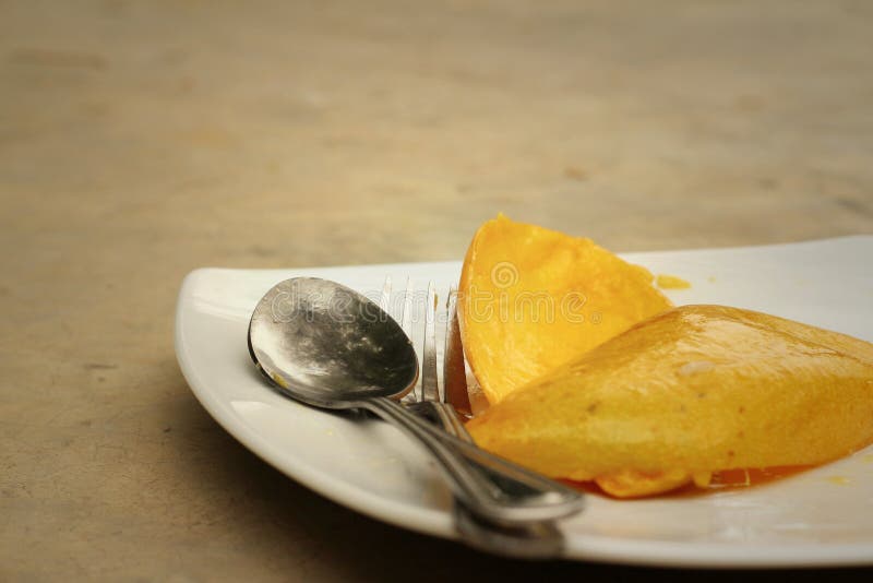 Yellow Peel Mango with Fork on White Plate. Stock Photo - Image of ...