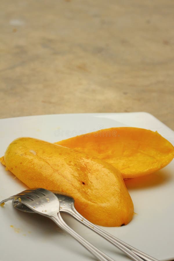 Yellow Peel Mango with Fork on White Plate. Stock Image - Image of ...