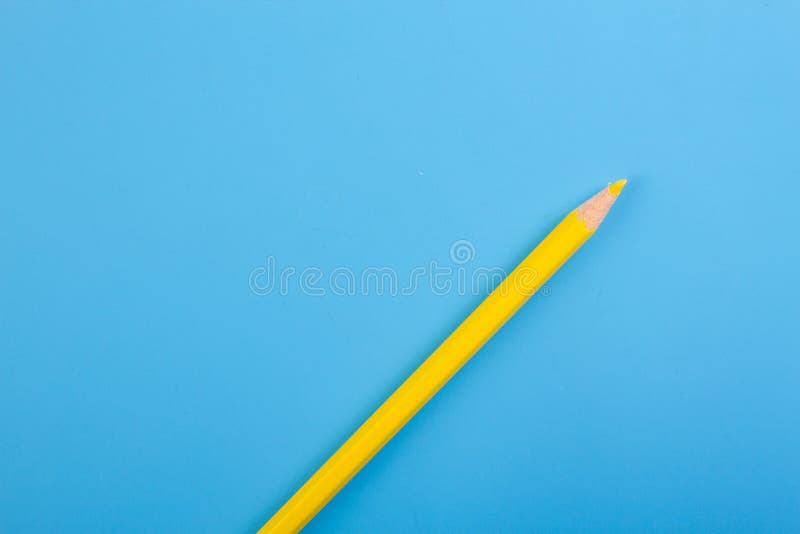 Yellow Pencil on Blue Background Stock Photo - Image of graphite ...