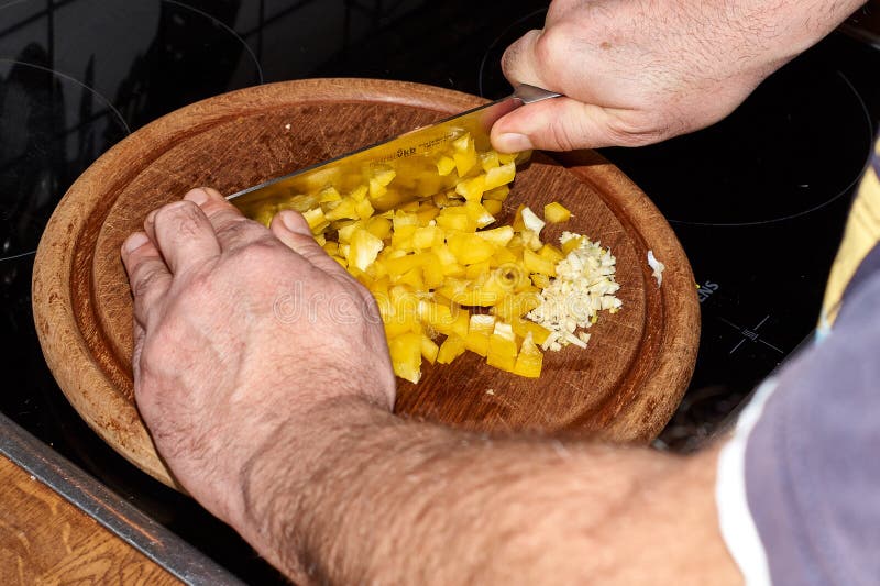 Yellow Peppers Capsicum Cut with a Knife on a Board. Stock Photo ...