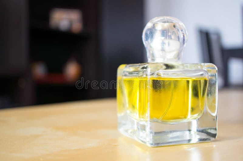 Yellow perfume bottle stock image. Image of table, bottle - 44741411